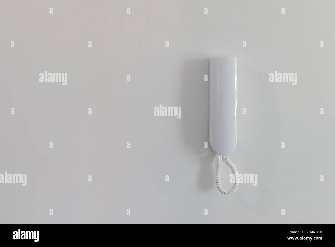 White intercom to open the door in the apartment Stock Photo - Alamy