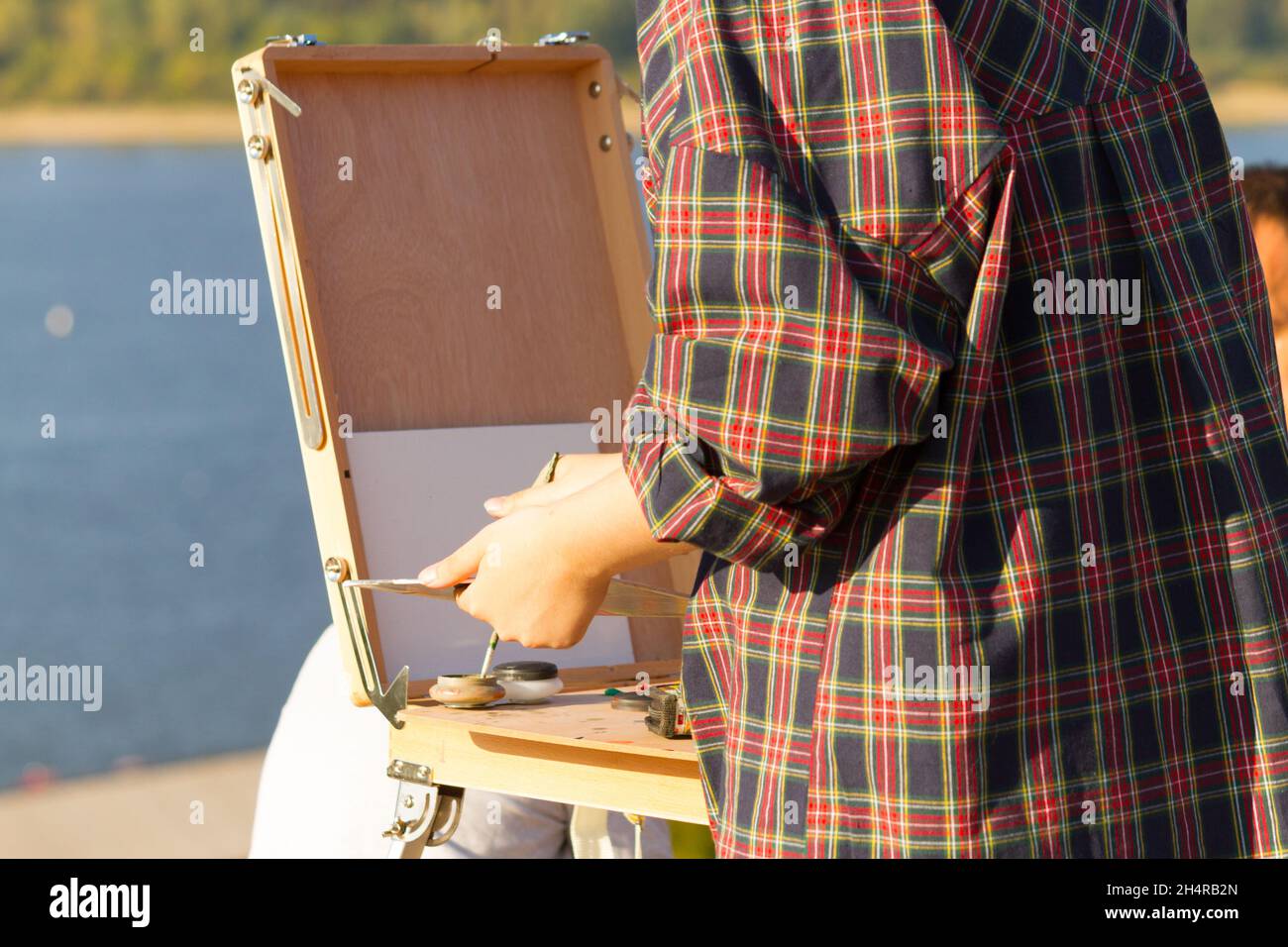 Artist working outside. Sunny day Stock Photo - Alamy