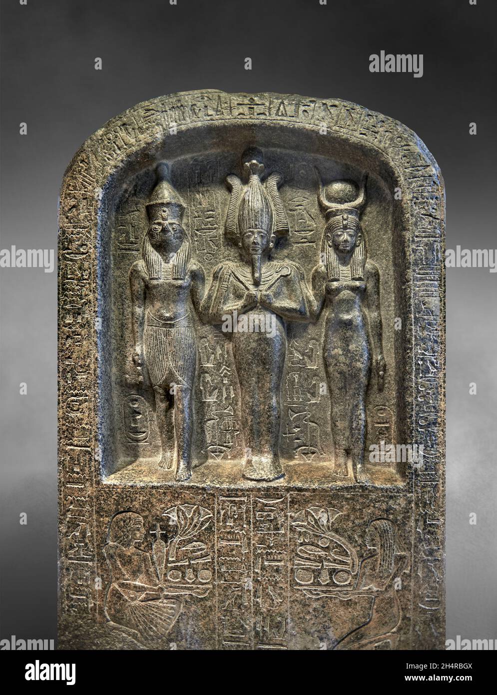 Ancient Egyptian stele of the patron gods of Abydos, Osiris, Horus and ...