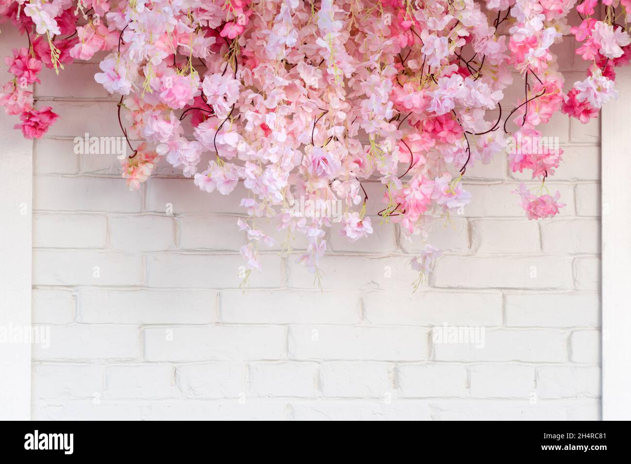 Flower texture background for wedding scene. Flowers on white brick ...