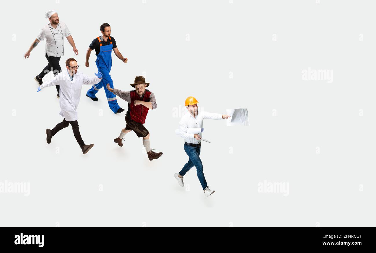 Hurry up. Group of men with different professions, jobs running ...