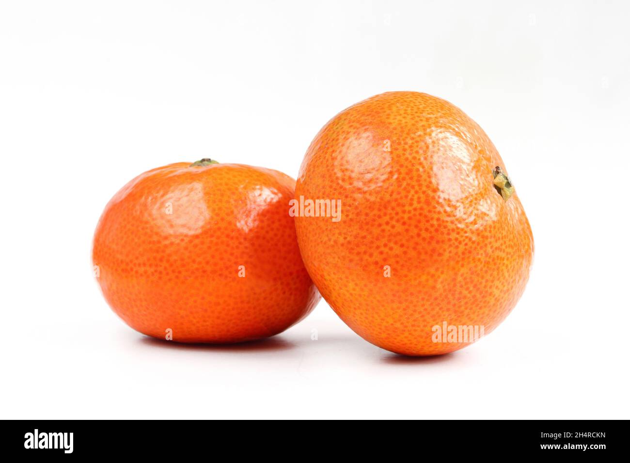 Two mandarines isolated on white background. Delicious healthy fruits ...
