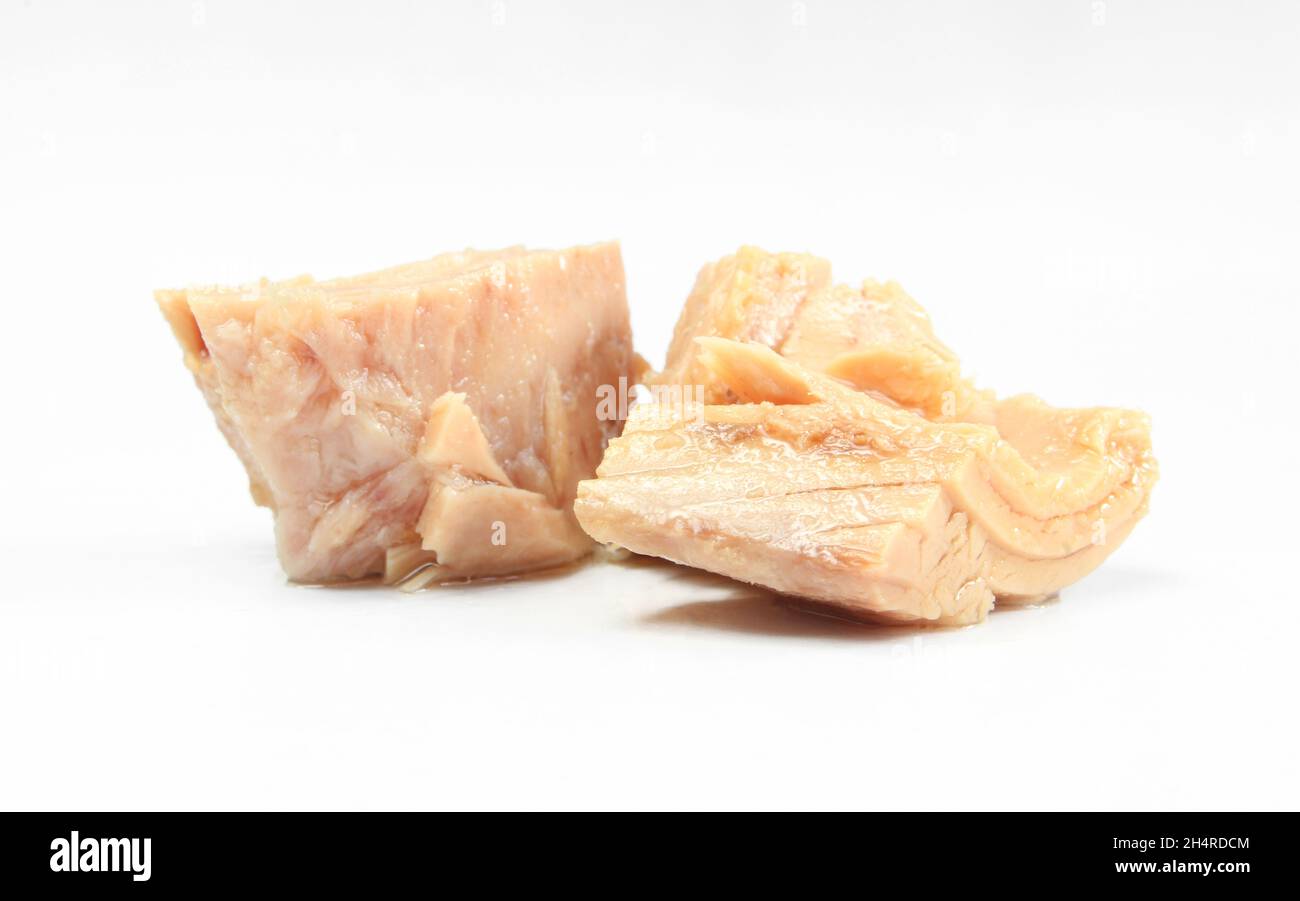 Pieces of tuna isolated on white background. Preserved and prepared ...