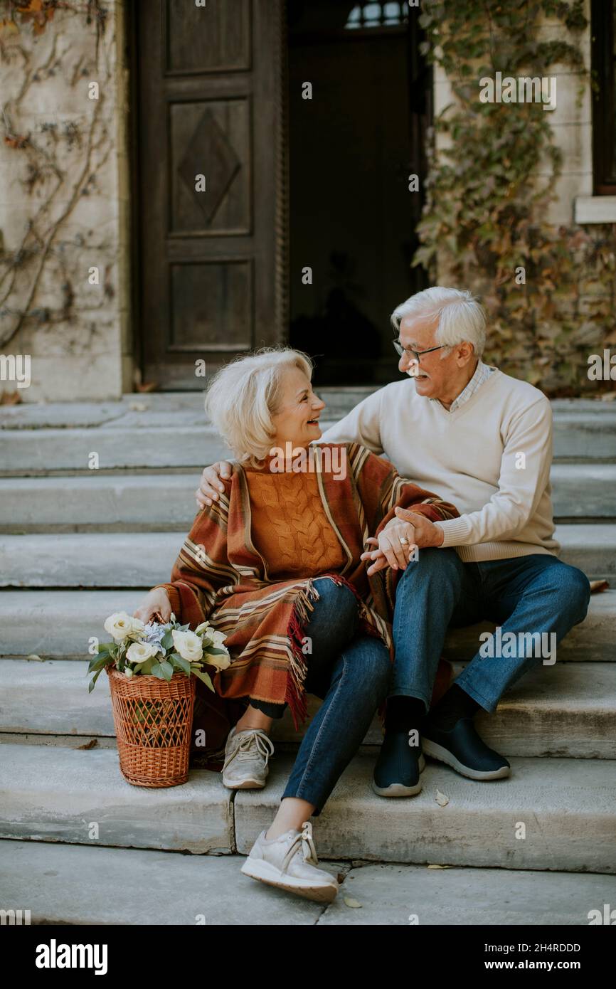 Two people sitting on stairs hi-res stock photography and images - Alamy