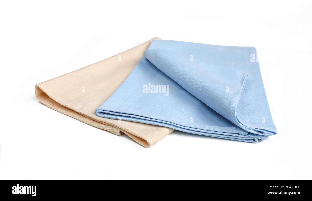 Two folded textile napkins isolated on white background Stock Photo - Alamy