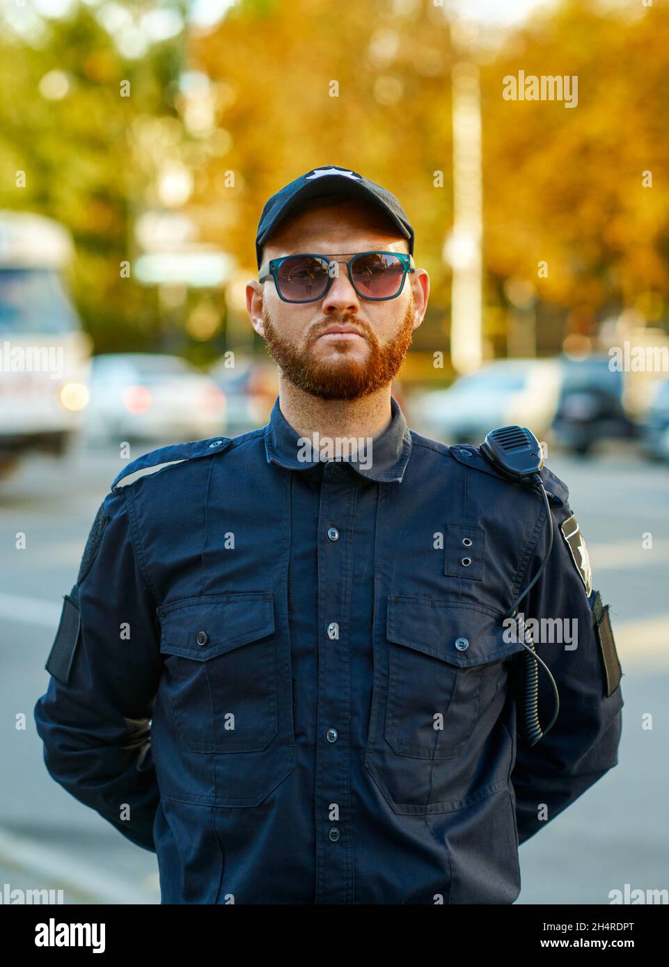 Police officer poses in uniform and sunglasses Stock Photo - Alamy