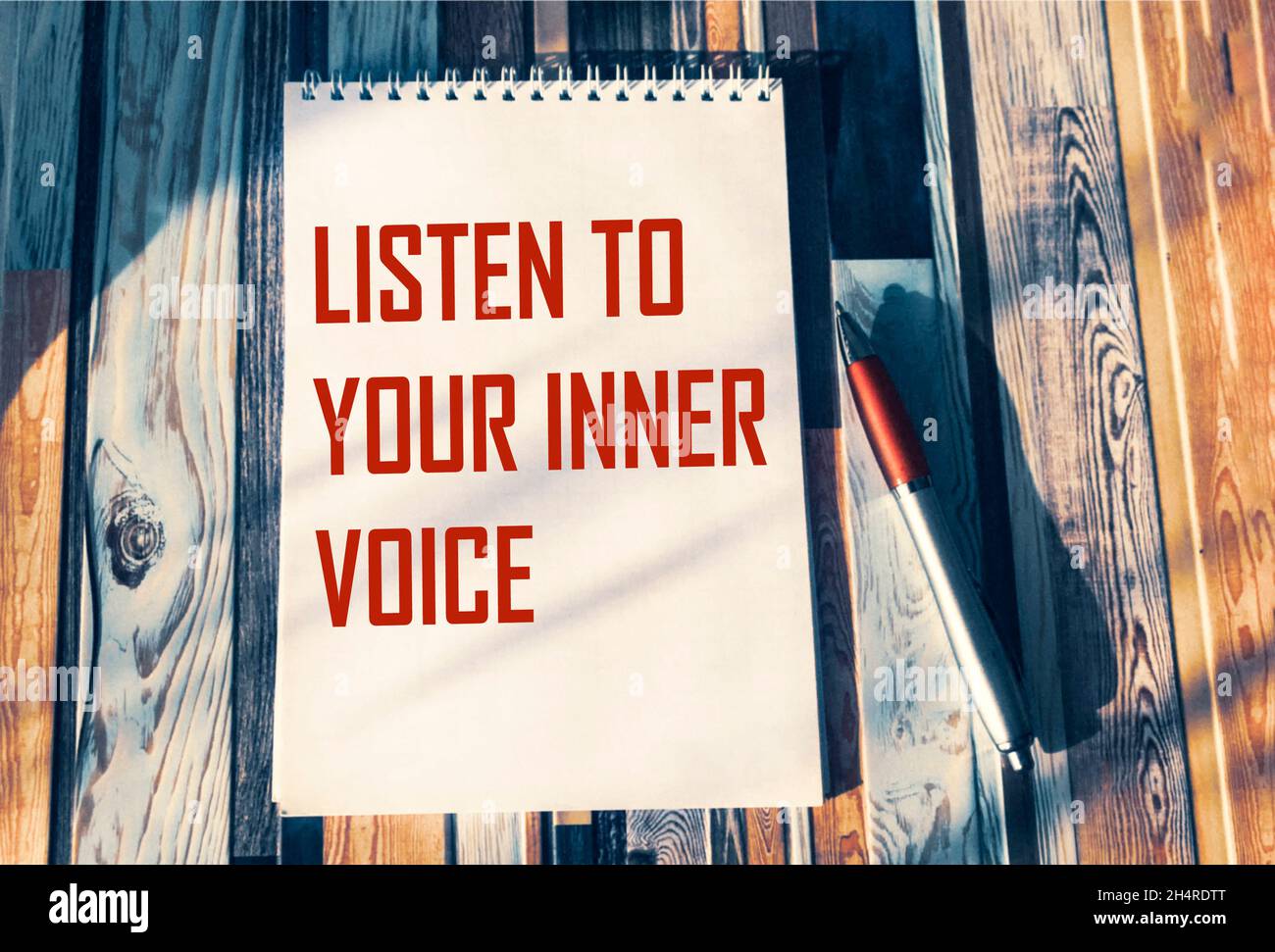 Listen to your inner voice - inspiring phrase on a notebook. Confidence ...