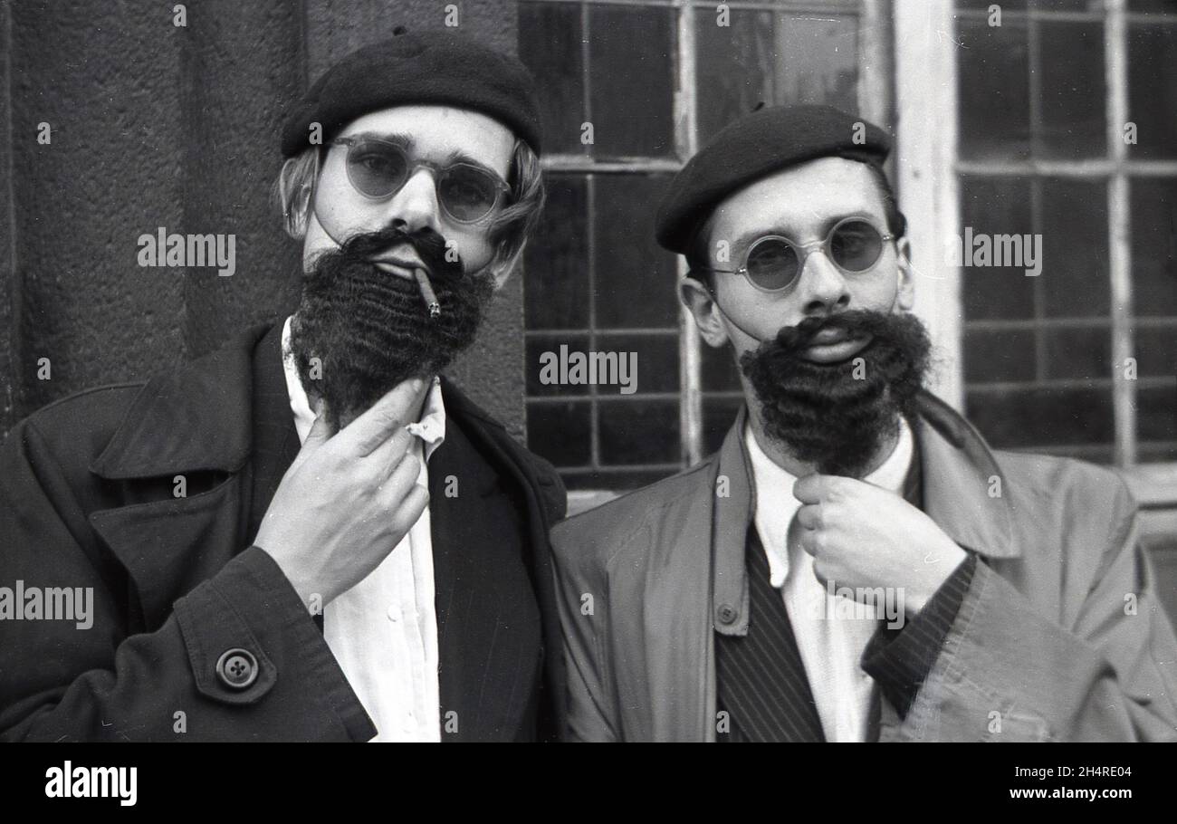 1960s, historical, two men standing outside a building in raincoats and ...
