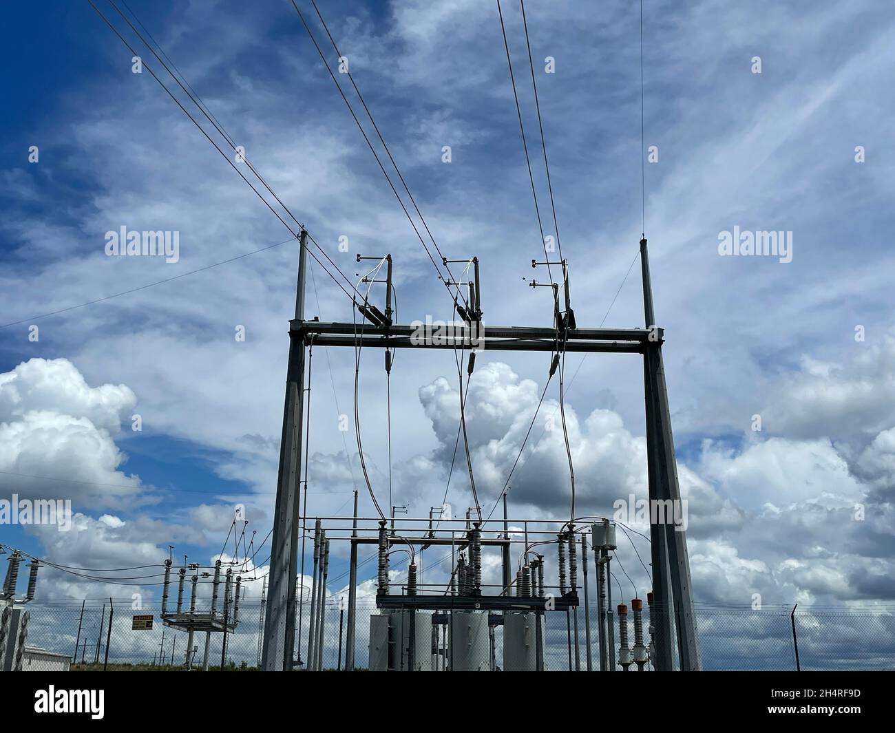fenced in power transformers and tall power poles in Georgia Stock ...