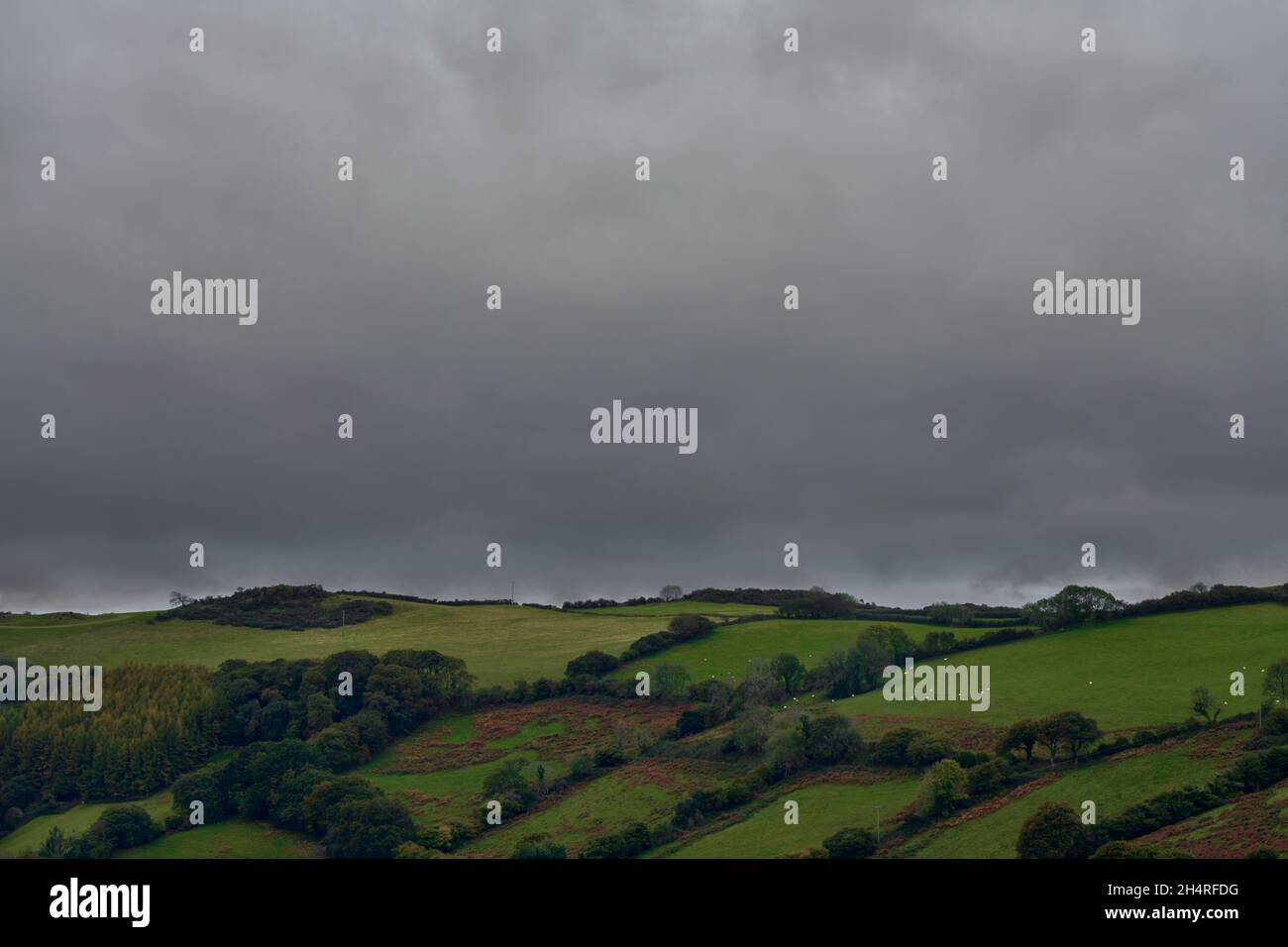 A stormy country side view of rolling hills Stock Photo - Alamy