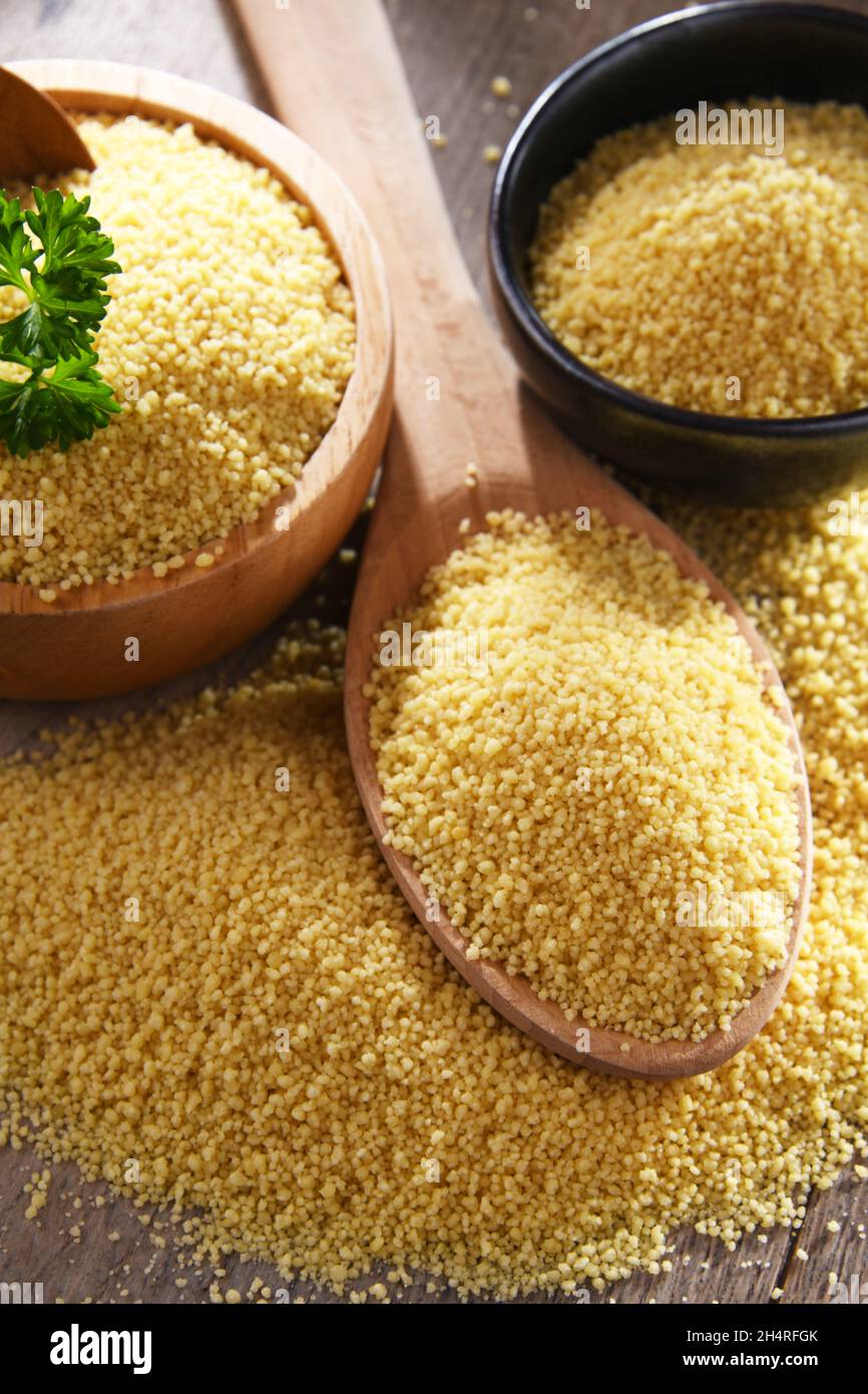 Composition with uncooked couscous Stock Photo - Alamy