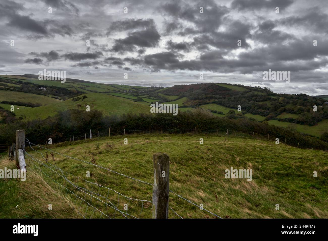 A stormy country side view of rolling hills Stock Photo - Alamy