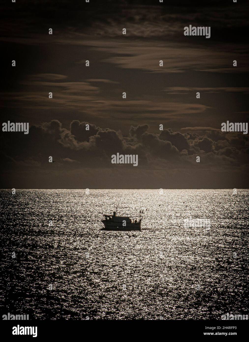 Hastings fishing boat out at sea, Hastings Stock Photo - Alamy