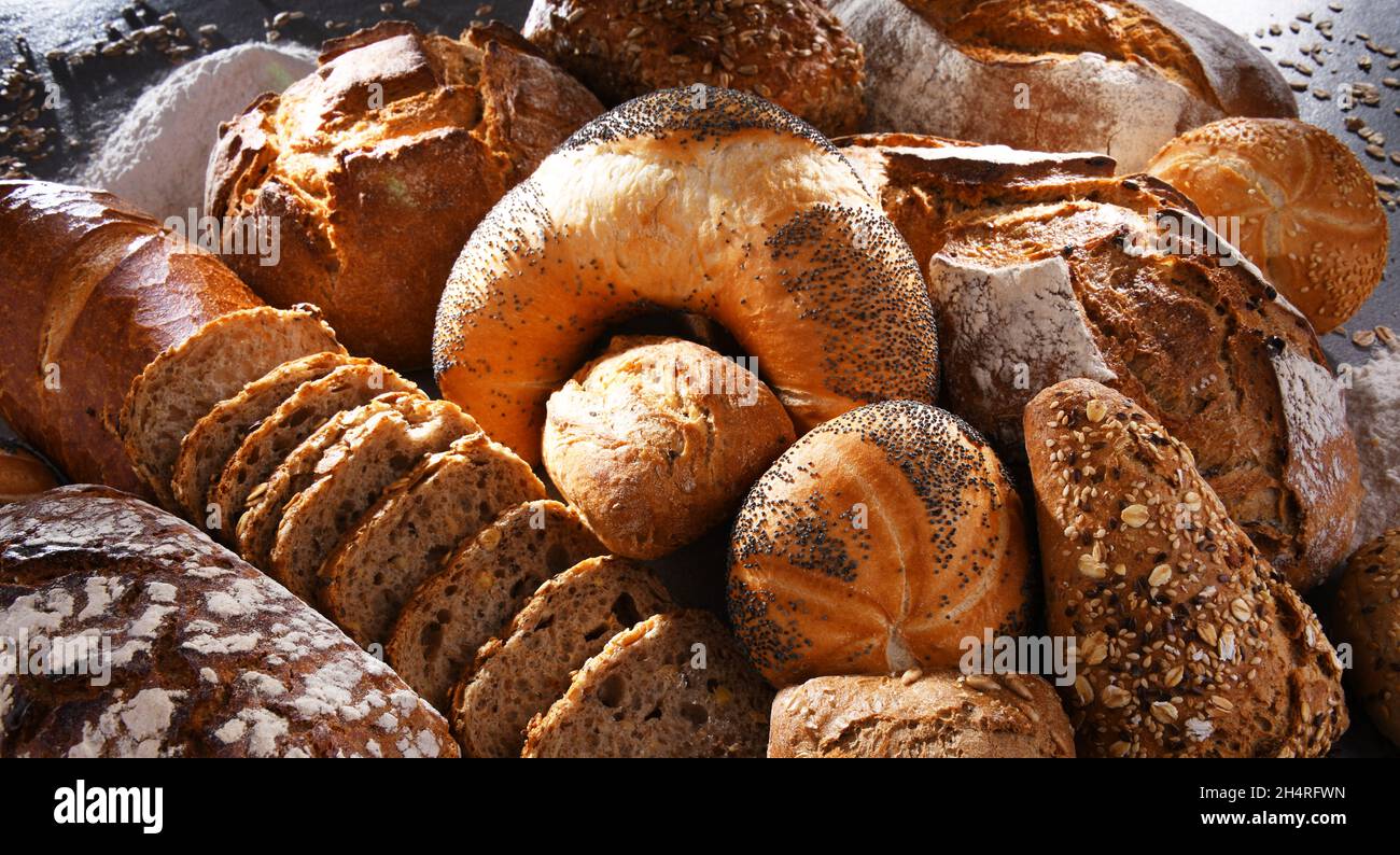 Assorted bakery products including loafs of bread and rolls Stock Photo ...