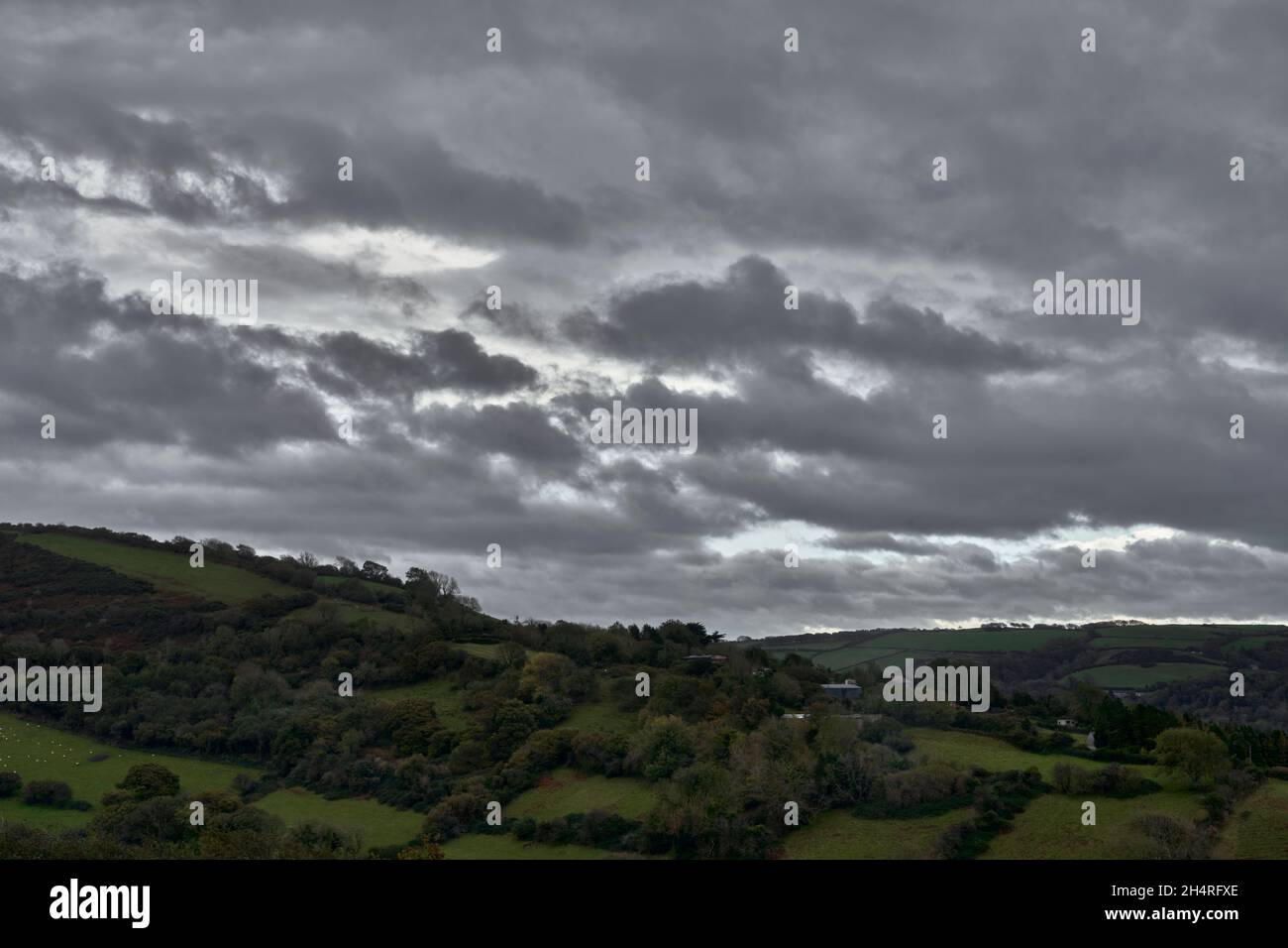 A stormy country side view of rolling hills Stock Photo - Alamy
