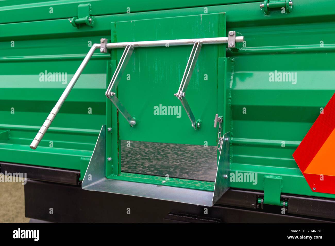 Manual Grain Door Open Gate at Farm Tipping Trailer Stock Photo - Alamy