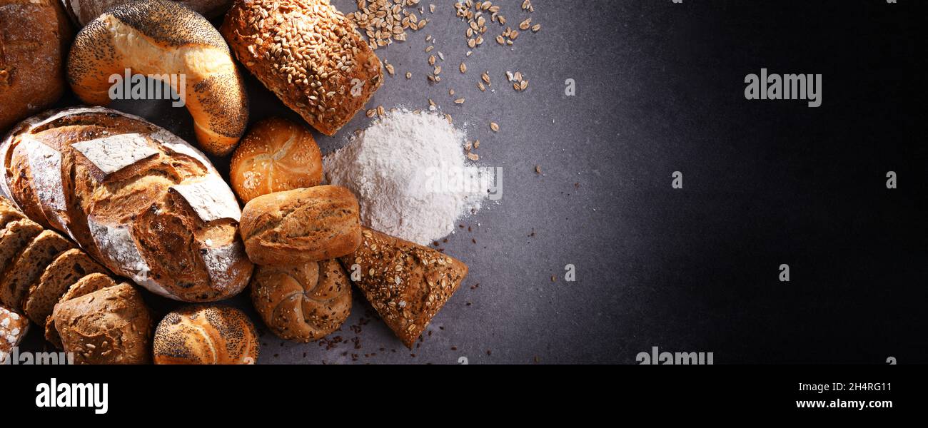 Assorted bakery products including loafs of bread and rolls Stock Photo ...