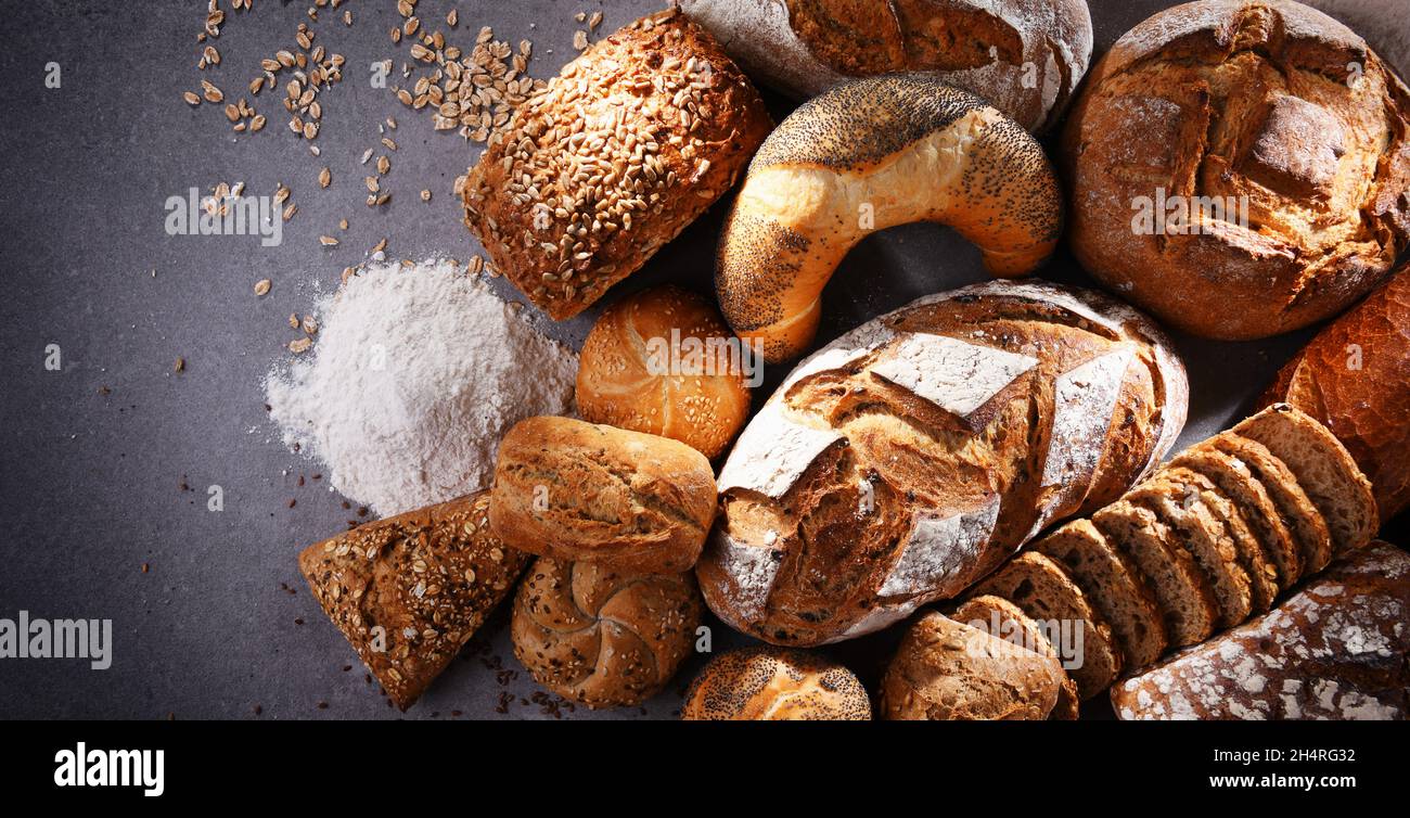 Assorted bakery products including loafs of bread and rolls Stock Photo ...