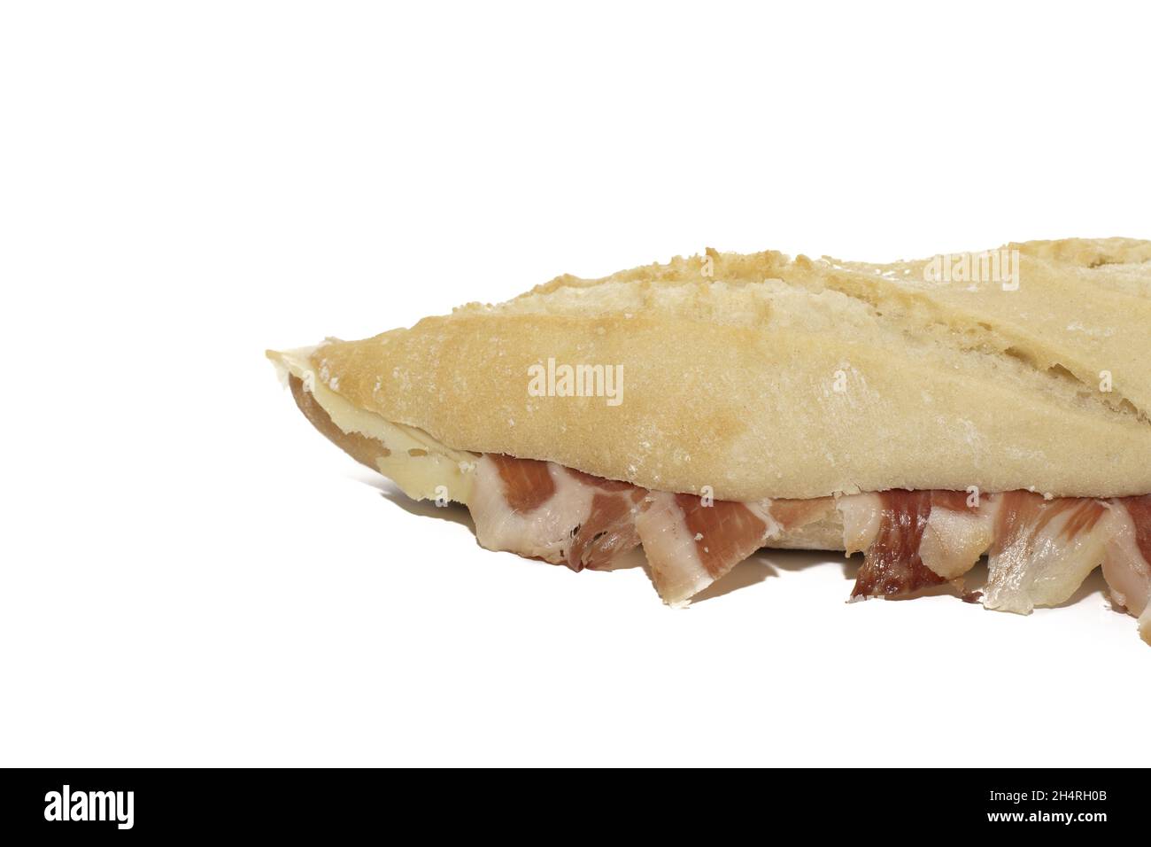 Traditional Spanish bocadillo ham sandwich with a crusty bread isolated ...