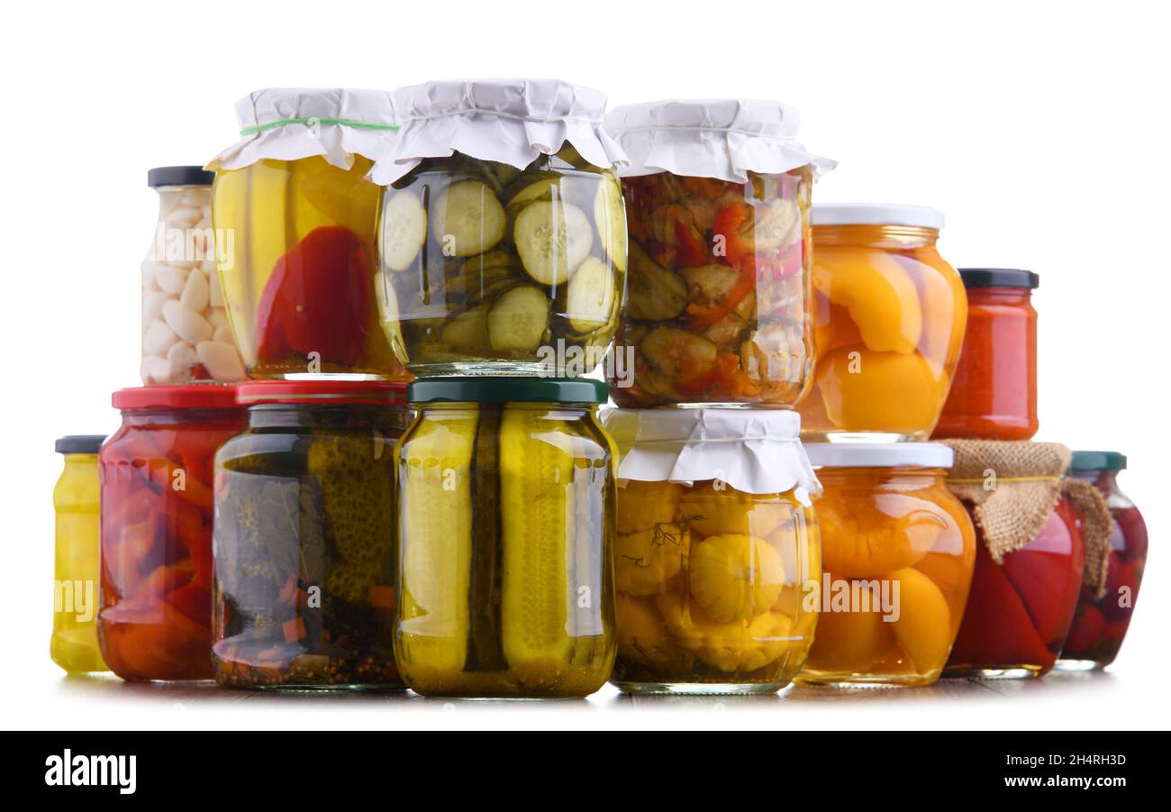 Jars with variety of marinated vegetables and fruits. Preserved food ...