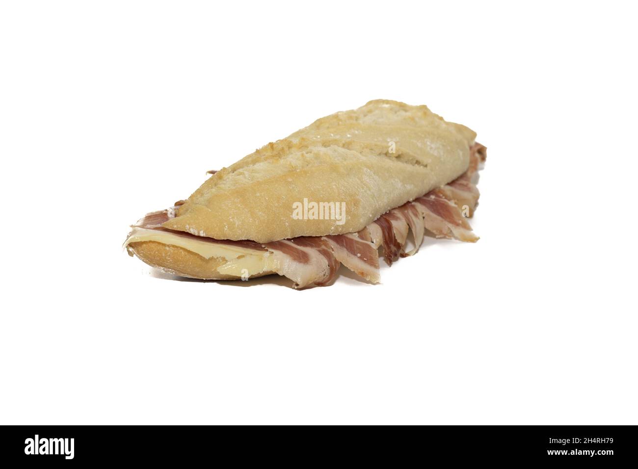 Traditional Spanish bocadillo ham sandwich with a crusty bread isolated ...