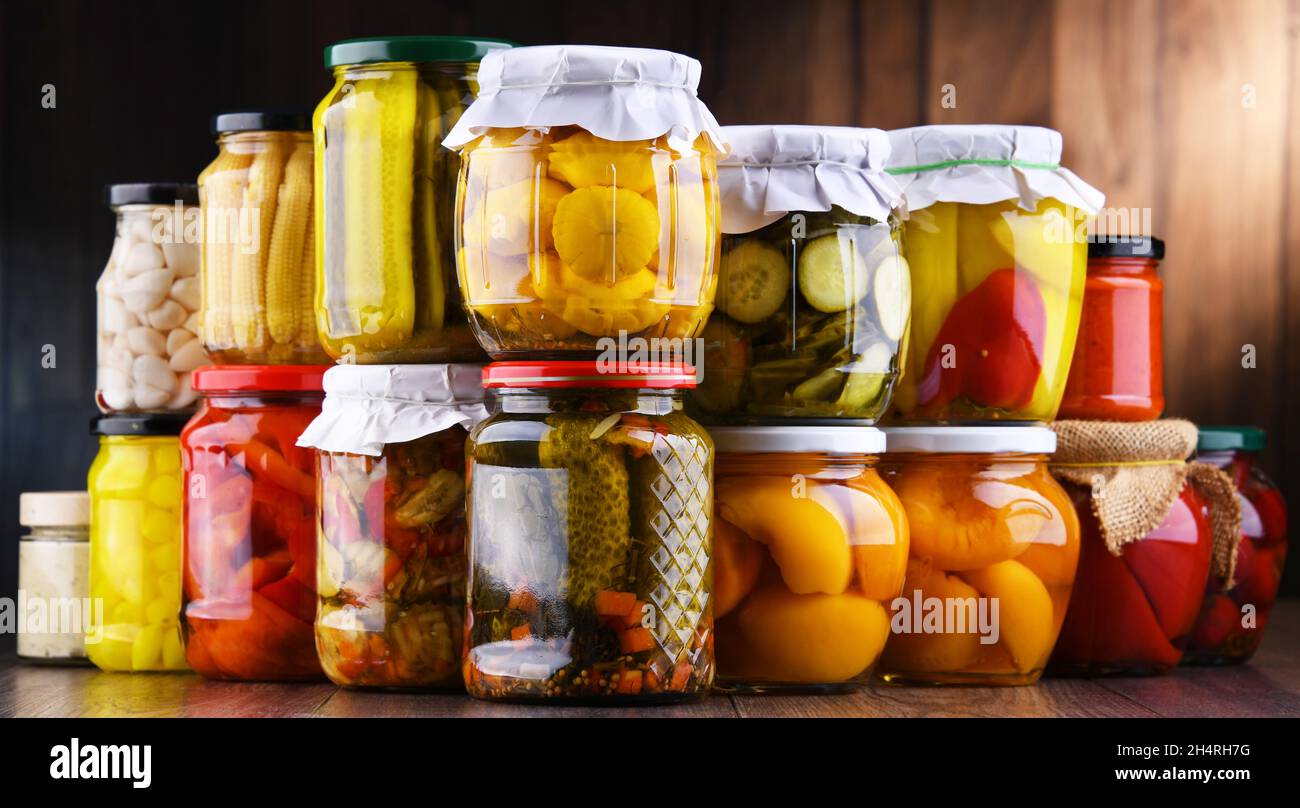 Jars with variety of marinated vegetables and fruits. Preserved food ...