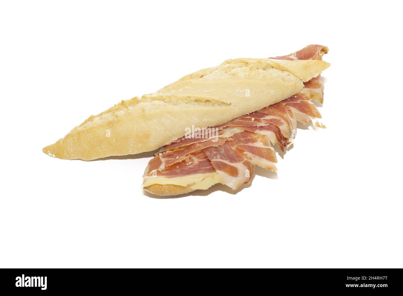 Traditional Spanish bocadillo ham sandwich with a crusty bread isolated ...