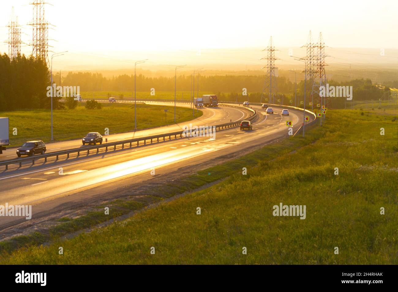 Hightway road in yellow sunset light Stock Photo - Alamy