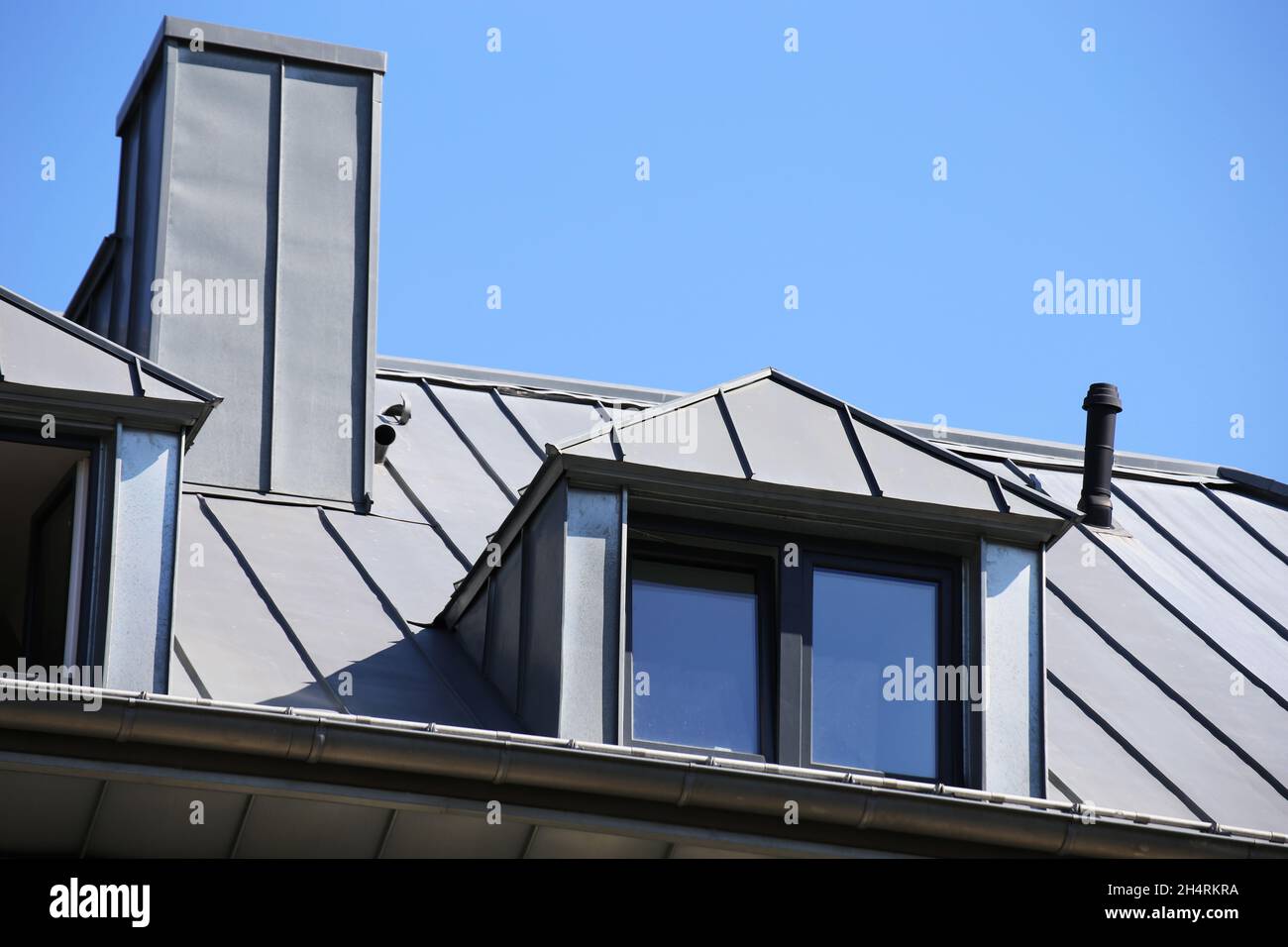 Dormer with zinc cladding on a tiled roof Stock Photo - Alamy