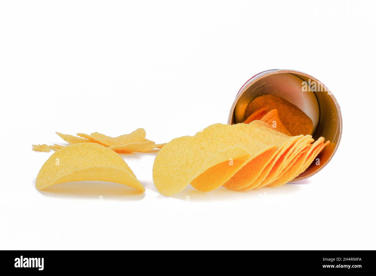 potato chips scattered from the packaging isolated on a white ...