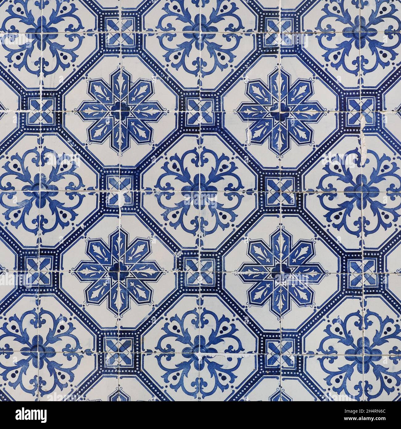 Fragment of building wall with colorful ceramic wall tiles. Azulejos ...