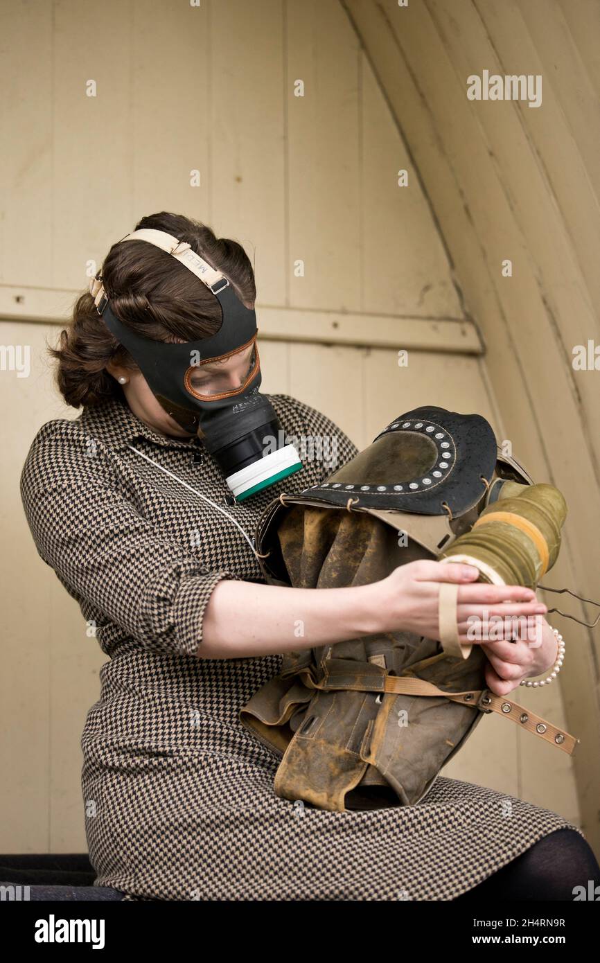 1940s Wartime Britain: Mother with her baby in a purpose-made gas mask ...