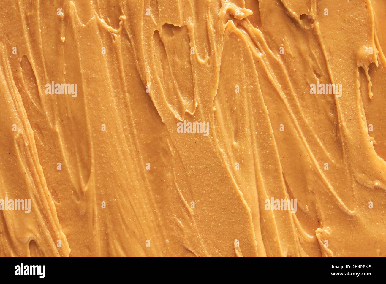 Peanut butter texture. Spread swirl. Organic keto food Stock Photo - Alamy