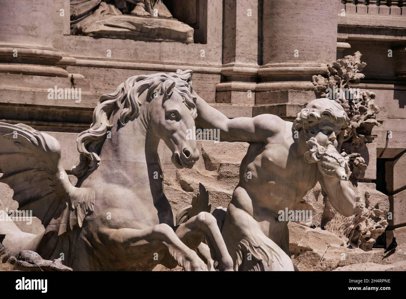 Closeup of the statues of the Trevi Fountain under the sunlight in Rome ...