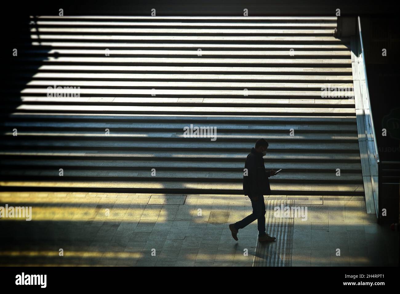 High angle view of a person silhouette walking at the underpass Stock ...