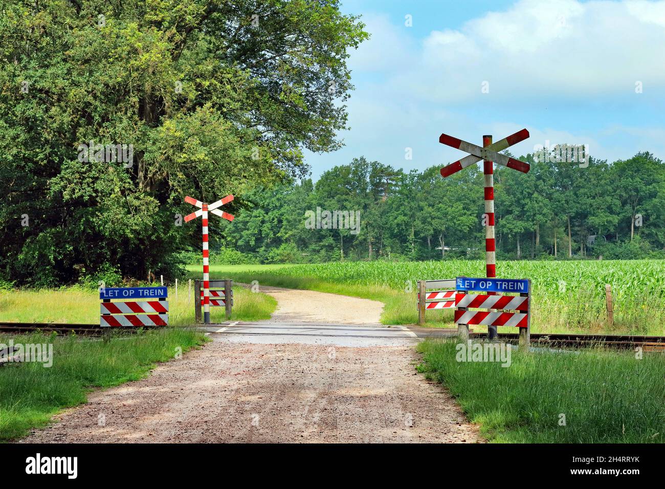 Unguarded railroad crossing Stock Photo - Alamy