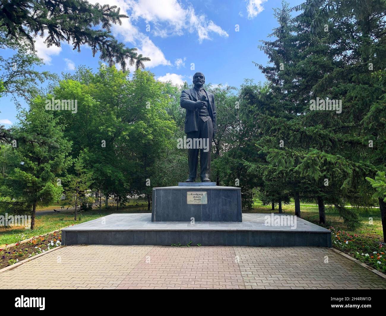 The Lenin statue in a center of Kazakhstan's city during summer time ...