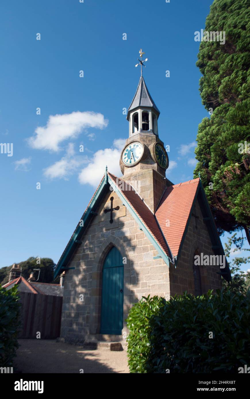 Clock Tower and trees and hedges at Cragside, Rothbury, Northumberland ...