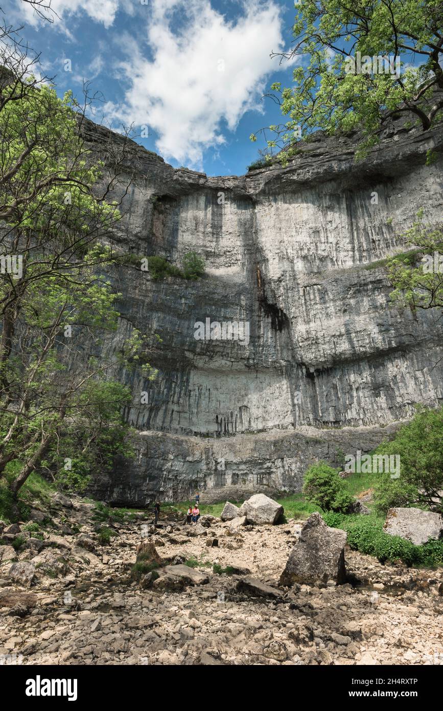 Malham Cove, view in summer of people visiting Malham Cove, a 260ft ...