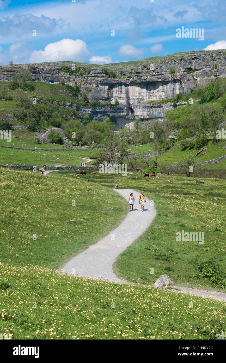 Pennine Way Yorkshire, view in summer of people walking a section of ...