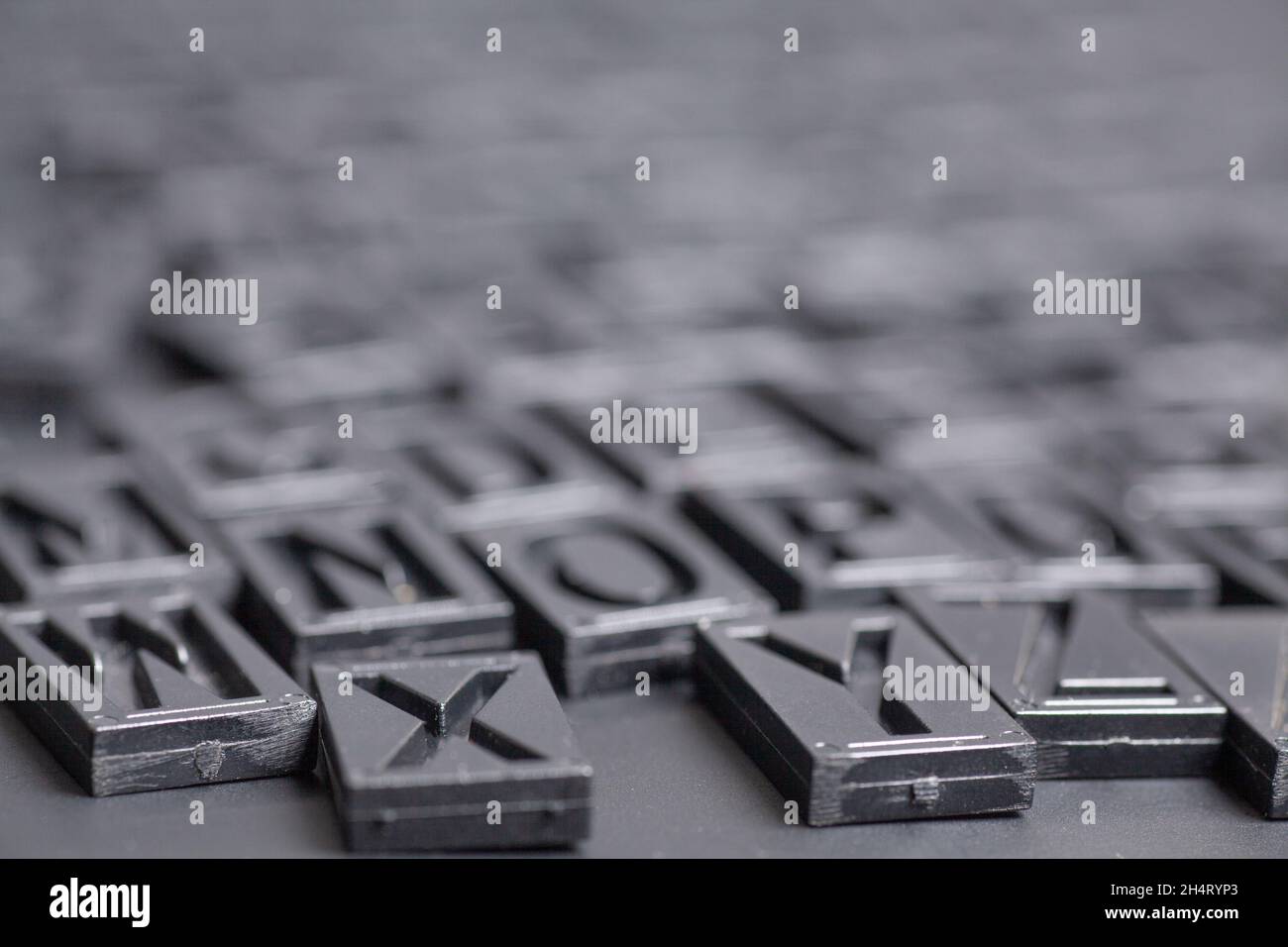 letterpress alphabet on black background Stock Photo - Alamy