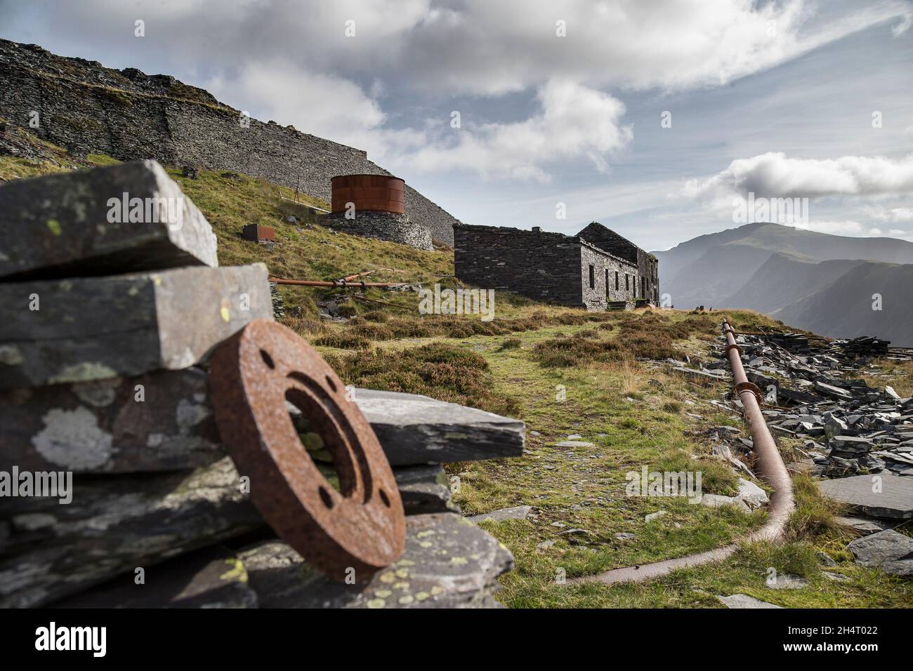 Abandoned equipment and buildings of a slate mining quarry, North Wales ...