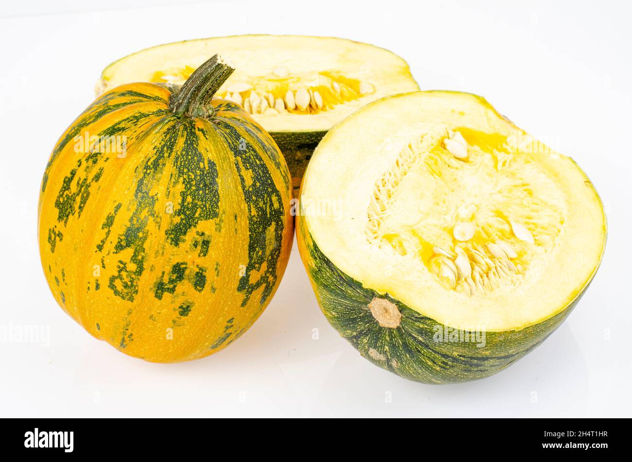 Small round pumpkin cut in half on white background. Studio Photo Stock ...