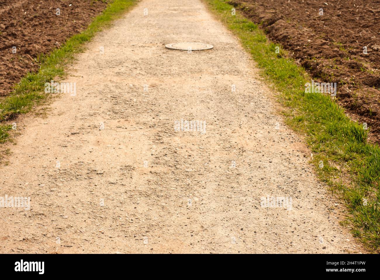 Field road with gravels and dirt Stock Photo - Alamy