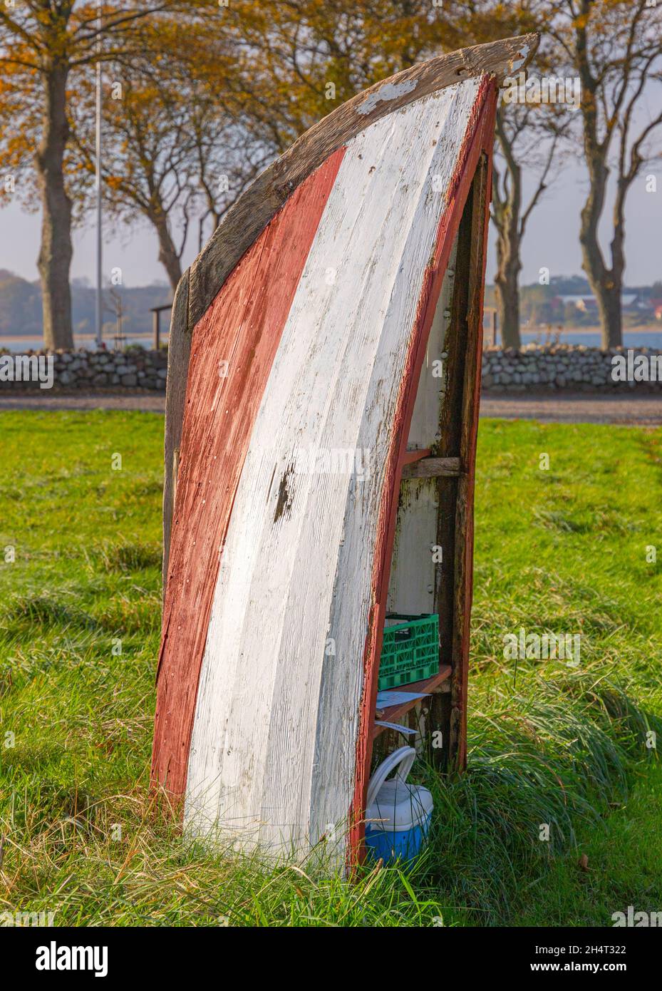 close-up of a part of an old weathered boat which is rebuilt as a sales ...