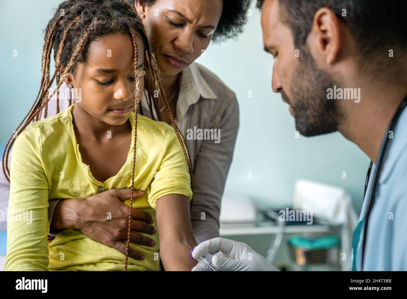 Pediatrician takes blood from a child patient. Healthcare antibody test ...
