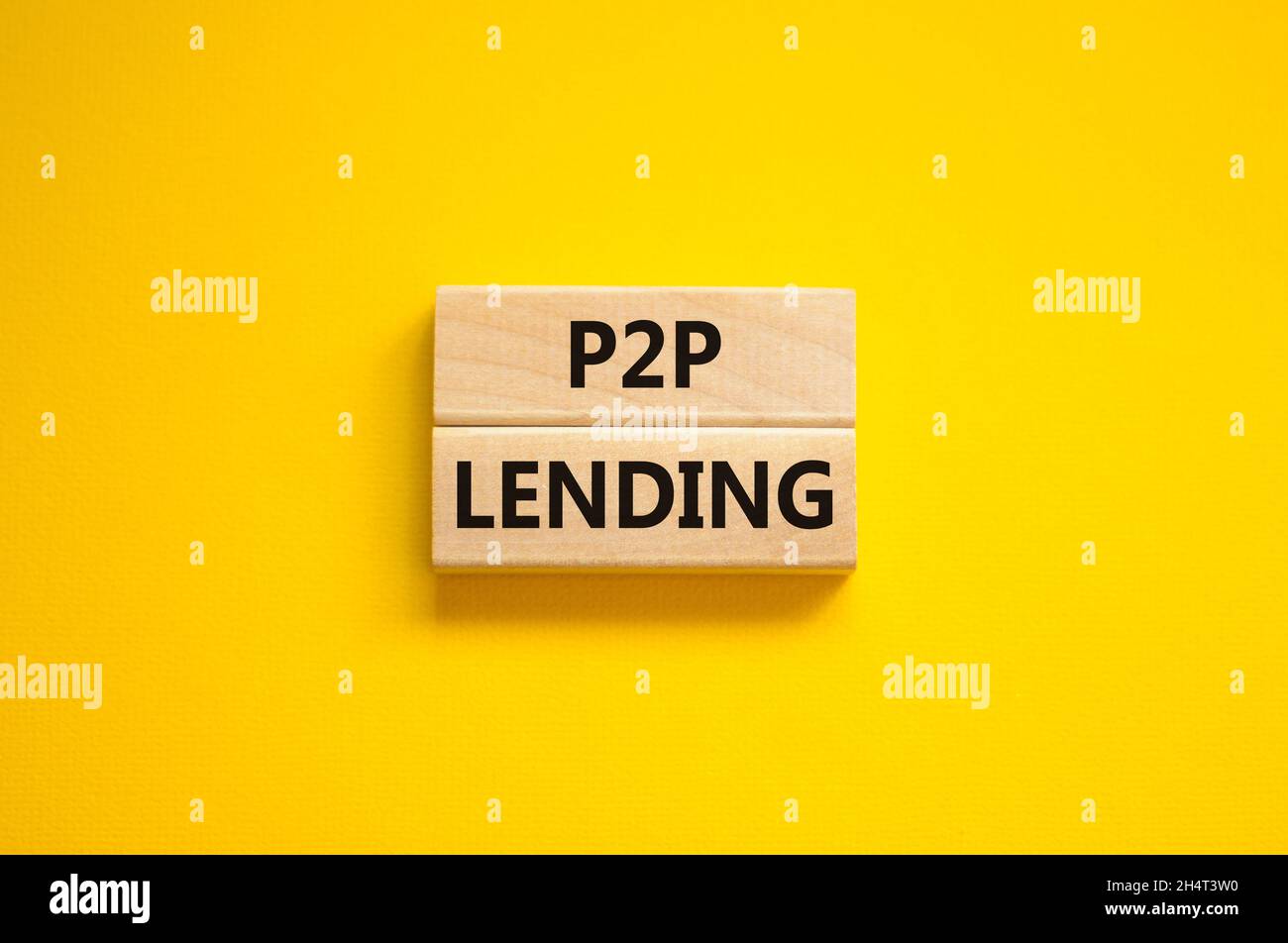 P2P peer to peer lending symbol. Concept words P2P lending on wooden ...