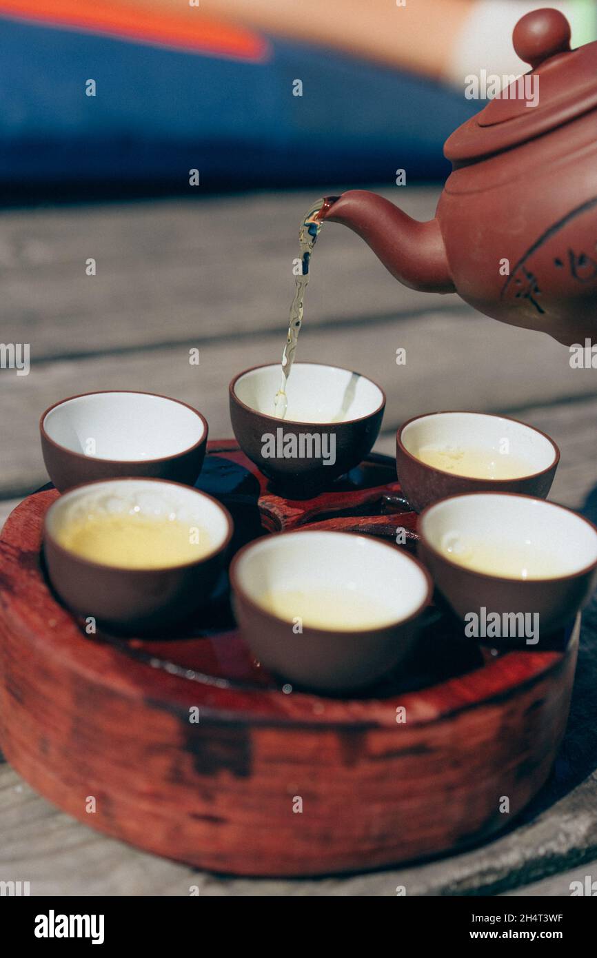 Tea ceremony, Woman pouring traditionally prepared tea Stock Photo - Alamy