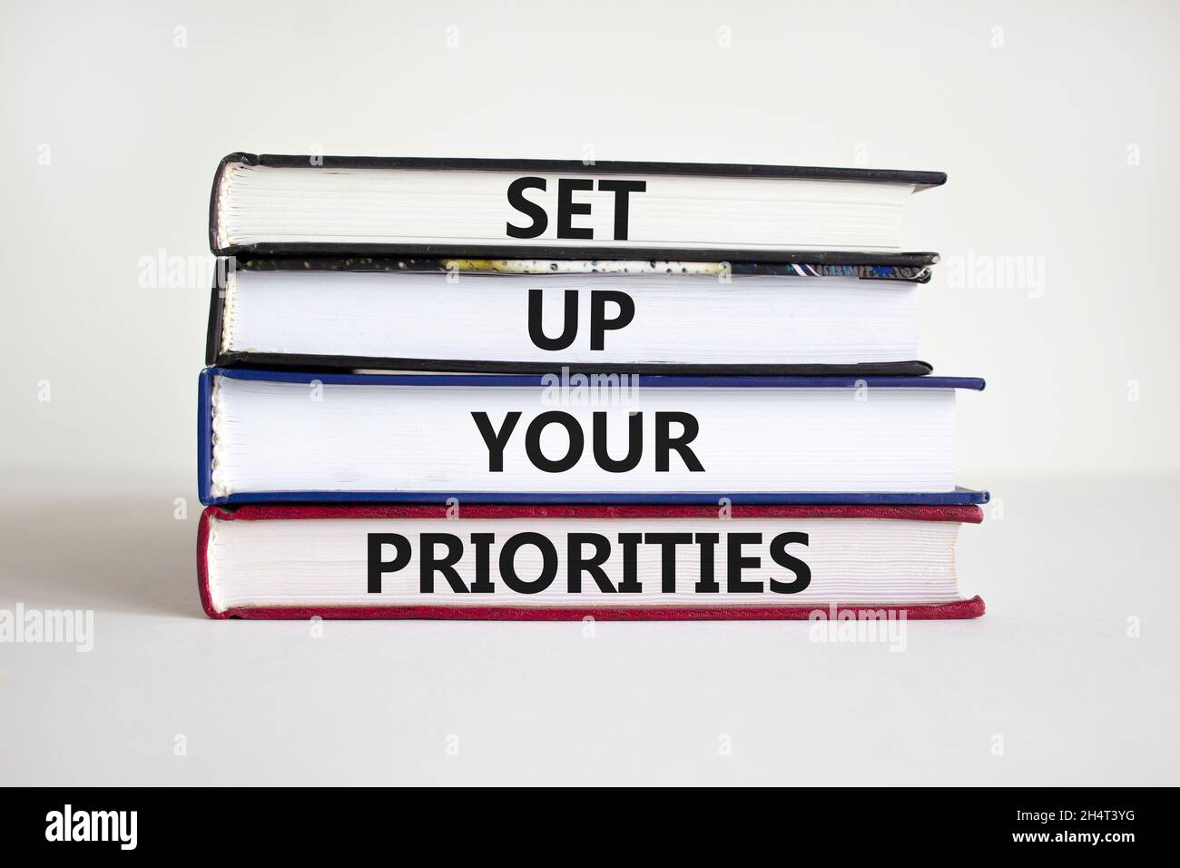 Set up your priorities symbol. Books with words 'Set up your priorities ...