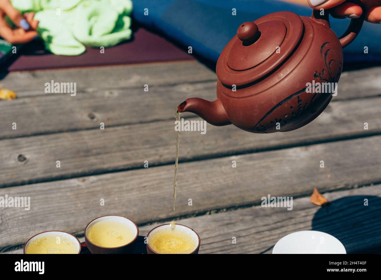 Tea ceremony, Woman pouring traditionally prepared tea Stock Photo - Alamy